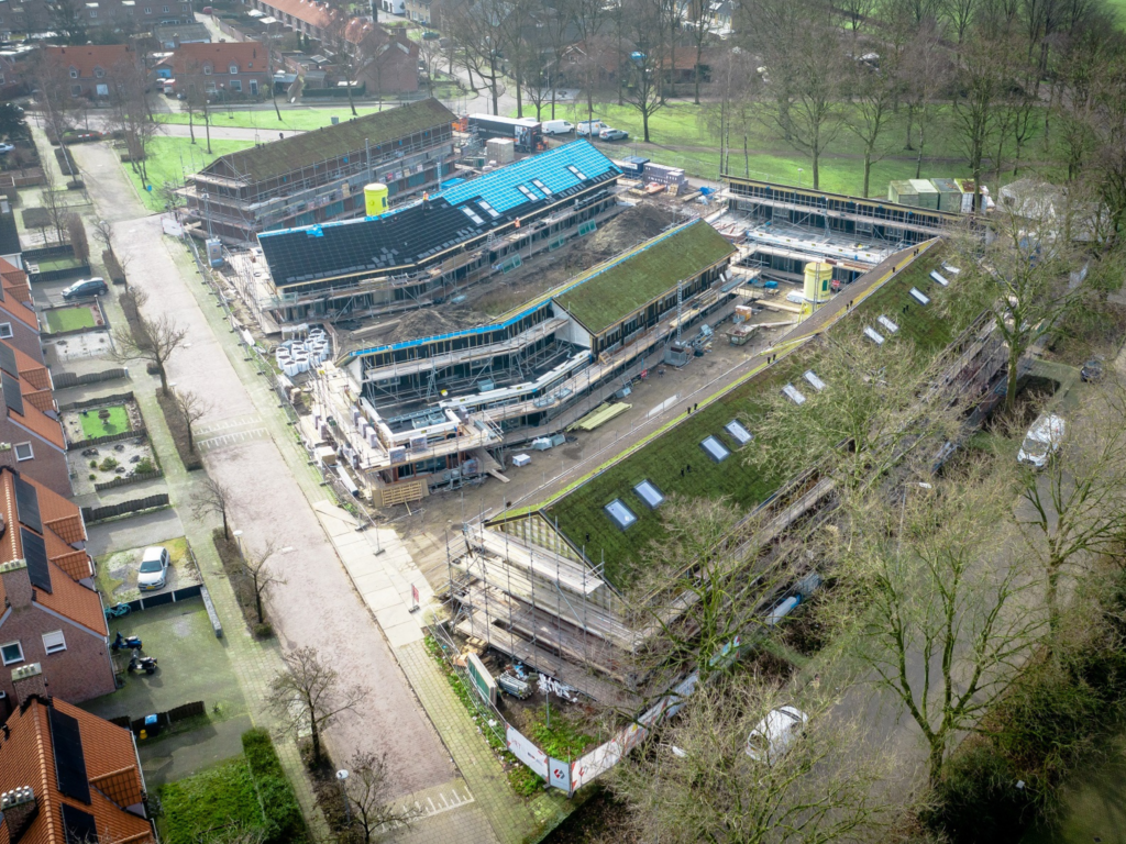 Future-proof building: Unique residential area with sloping green roofs ...